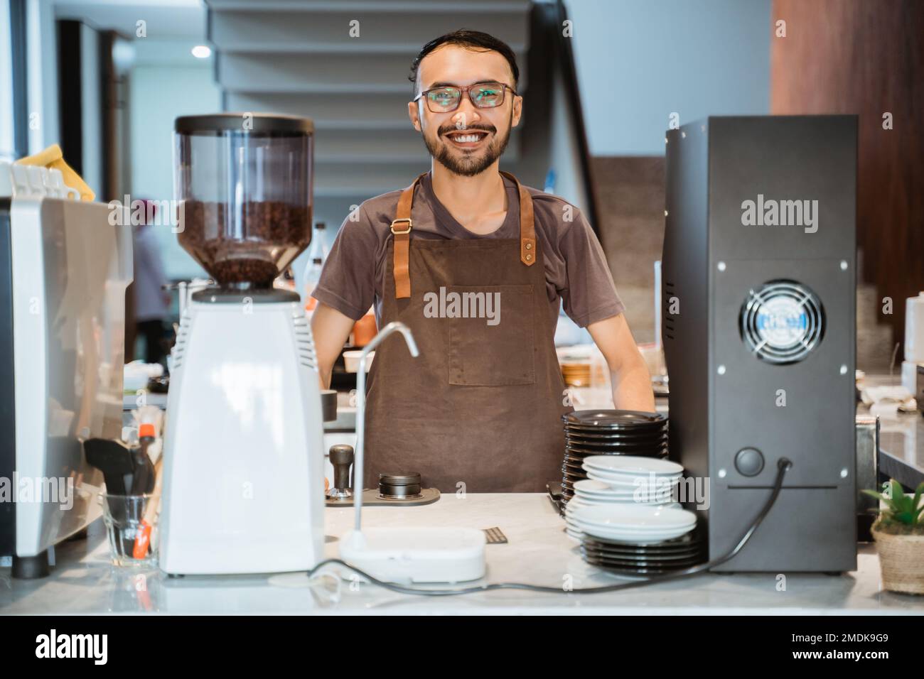 Male staff working behind counter hi-res stock photography and images ...