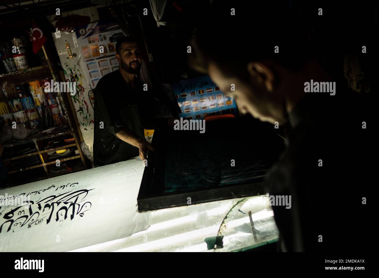 Workers hand print Taliban flags in a small workshop in Kabul's Jawid ...