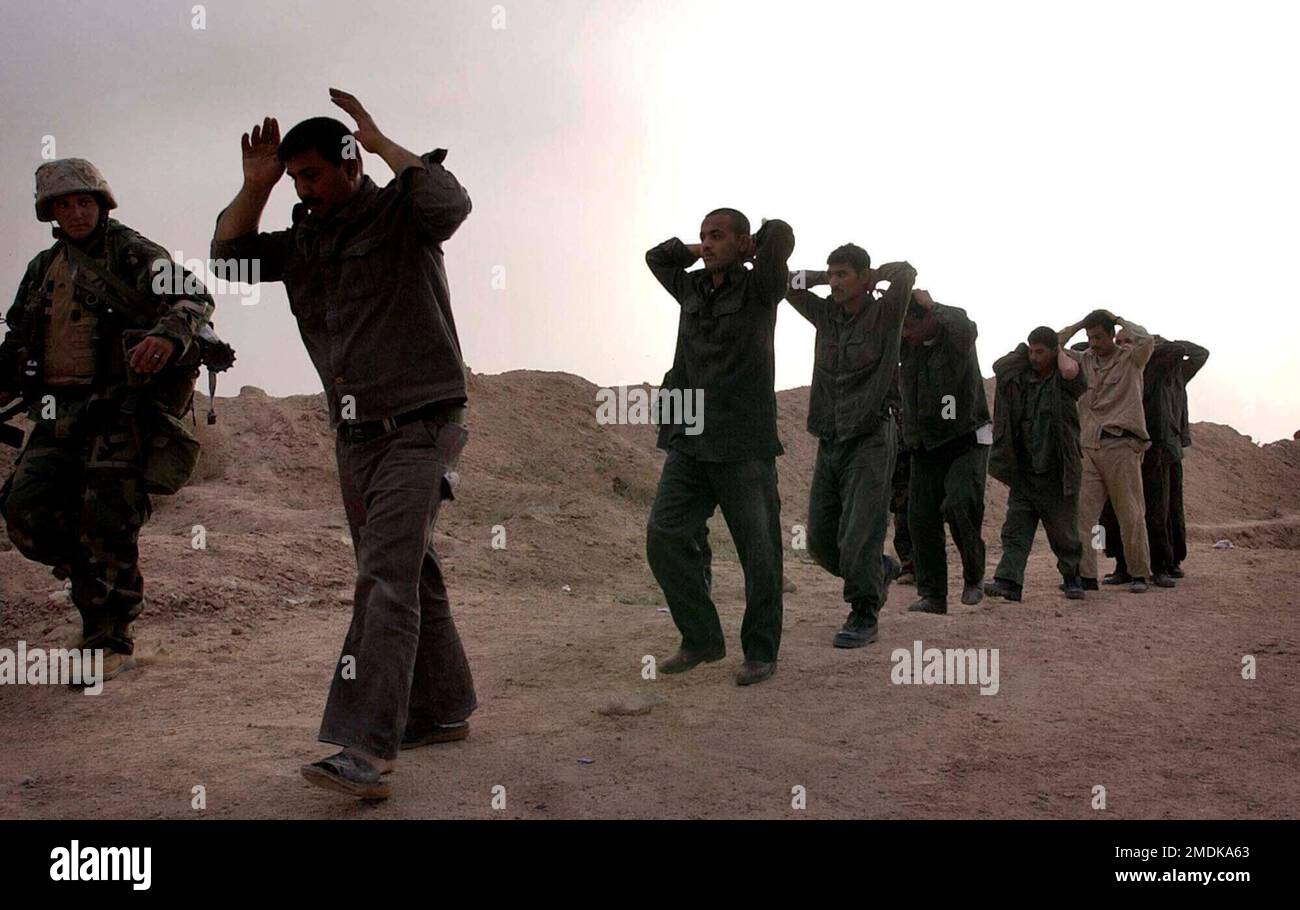 FILE - In this March 21, 2003, file photo, Iraqi soldiers surrender to ...