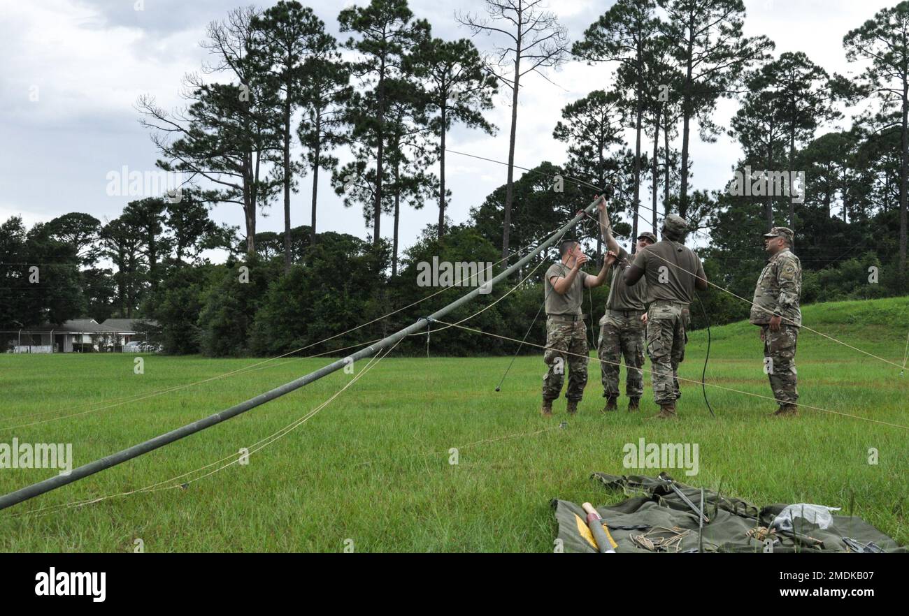 Soldiers with the 350th Civil Affairs Command's signal section train on emplacing an OE-254 ...