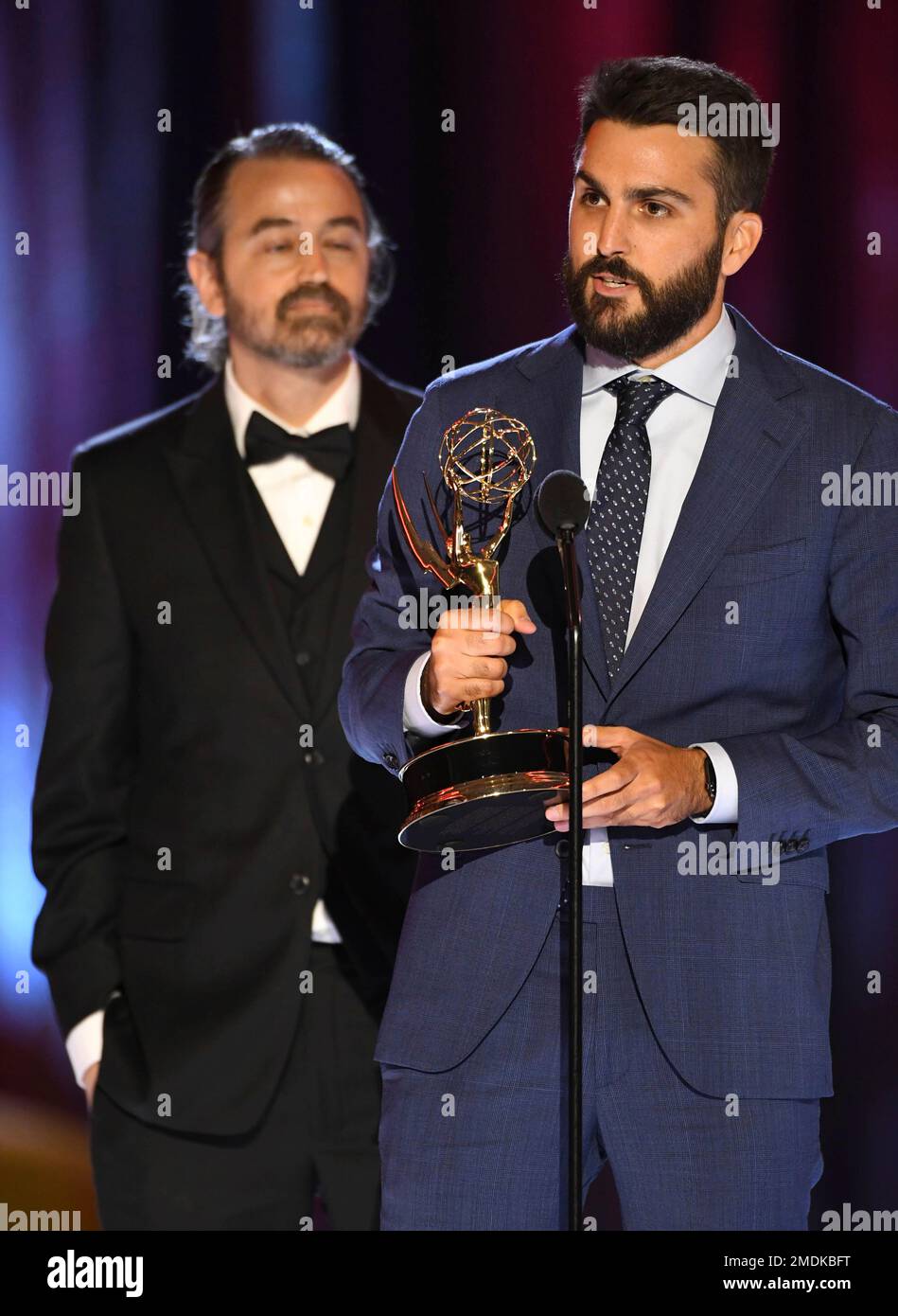 Eric Hirsch, from left, Eric Hoehn accept the award for outstanding ...