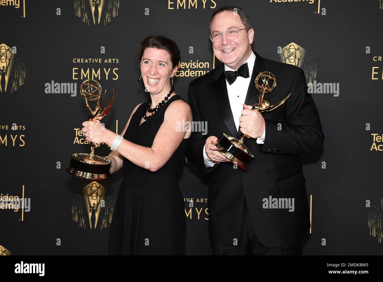 Alana Billingsley and Joe Celli pose for a portrait with their awards ...