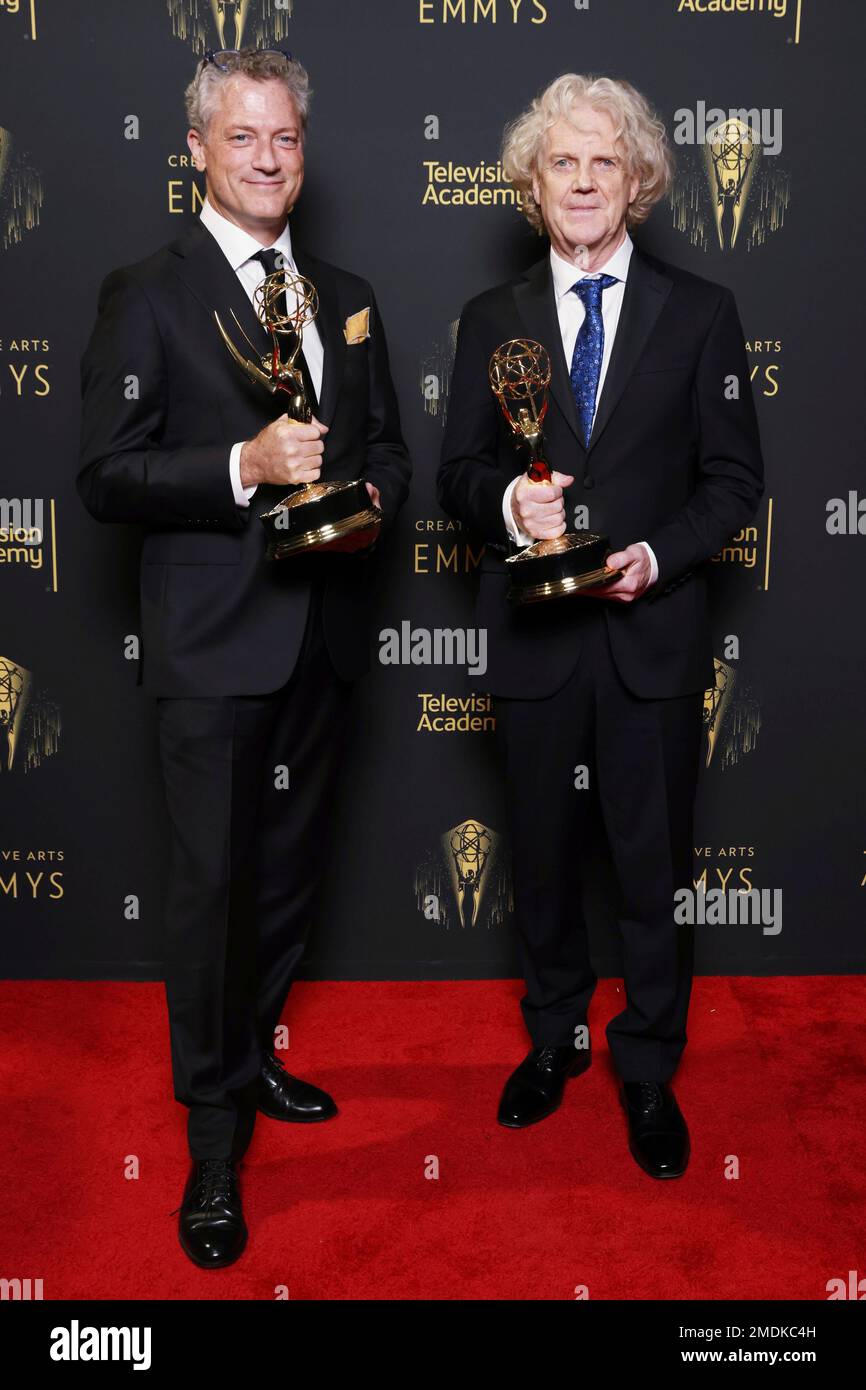 Keith Cunningham and Edward McLoughlin pose for a portrait with their ...
