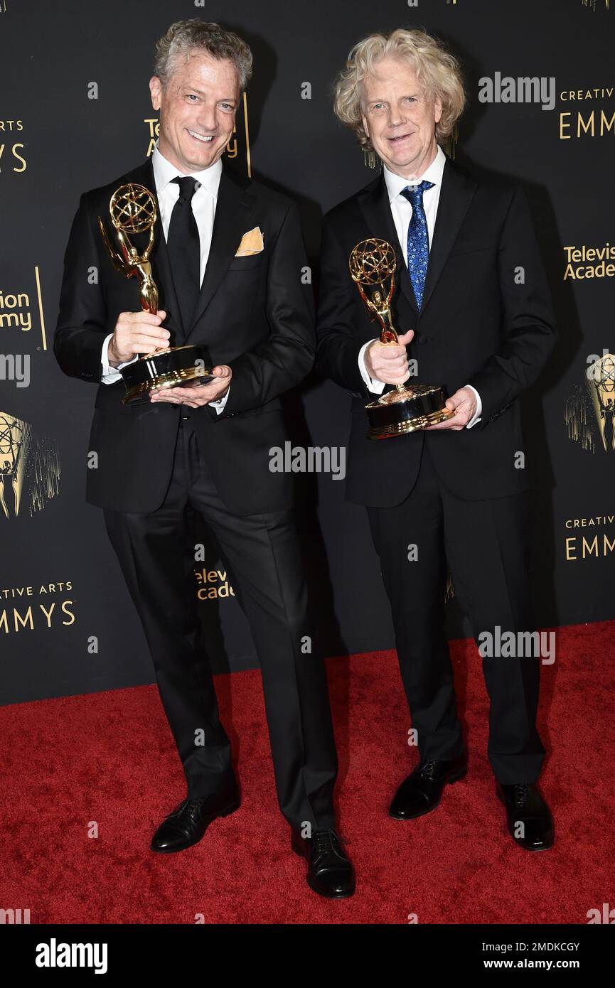 Keith Cunningham and Edward McLoughlin pose for a portrait with their ...
