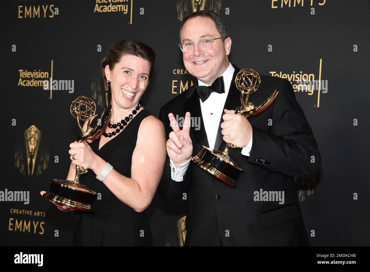 Alana Billingsley and Joe Celli pose for a portrait with their awards ...