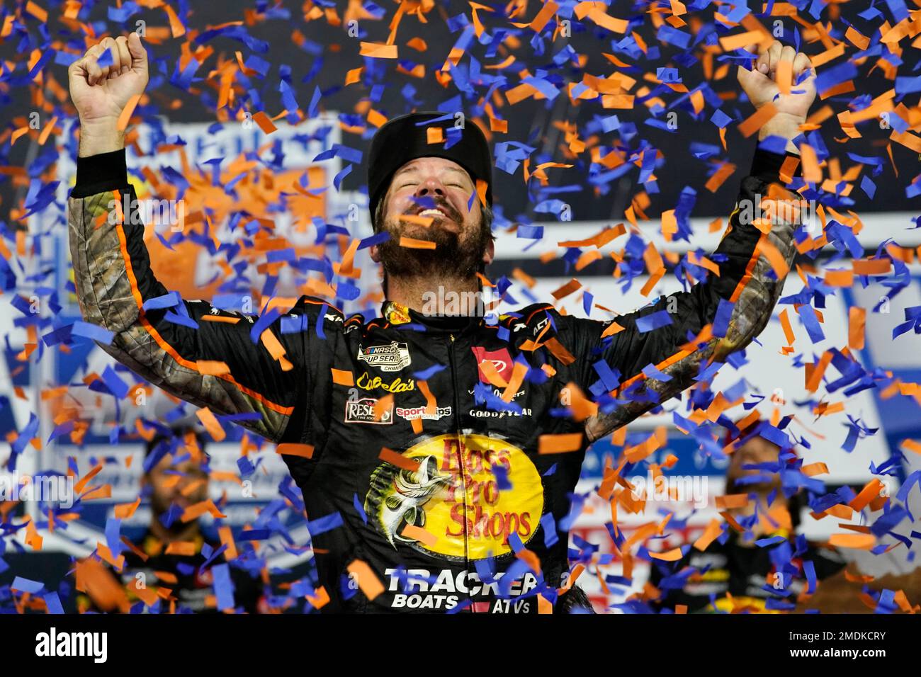 Martin Truex Jr., celebrates winning the NASCAR Cup series auto race in ...