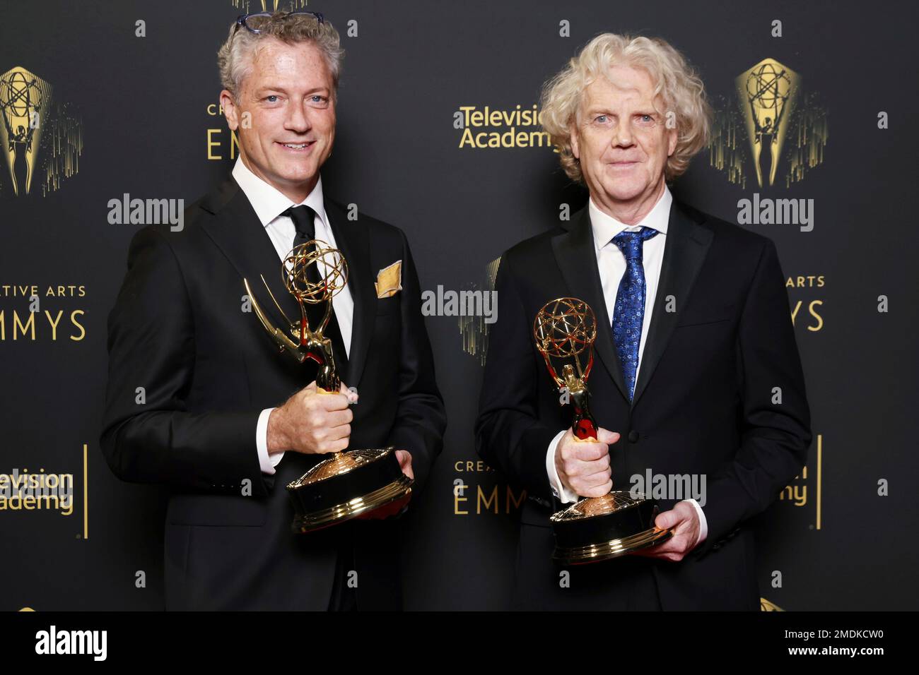 Keith Cunningham and Edward McLoughlin pose for a portrait with their ...