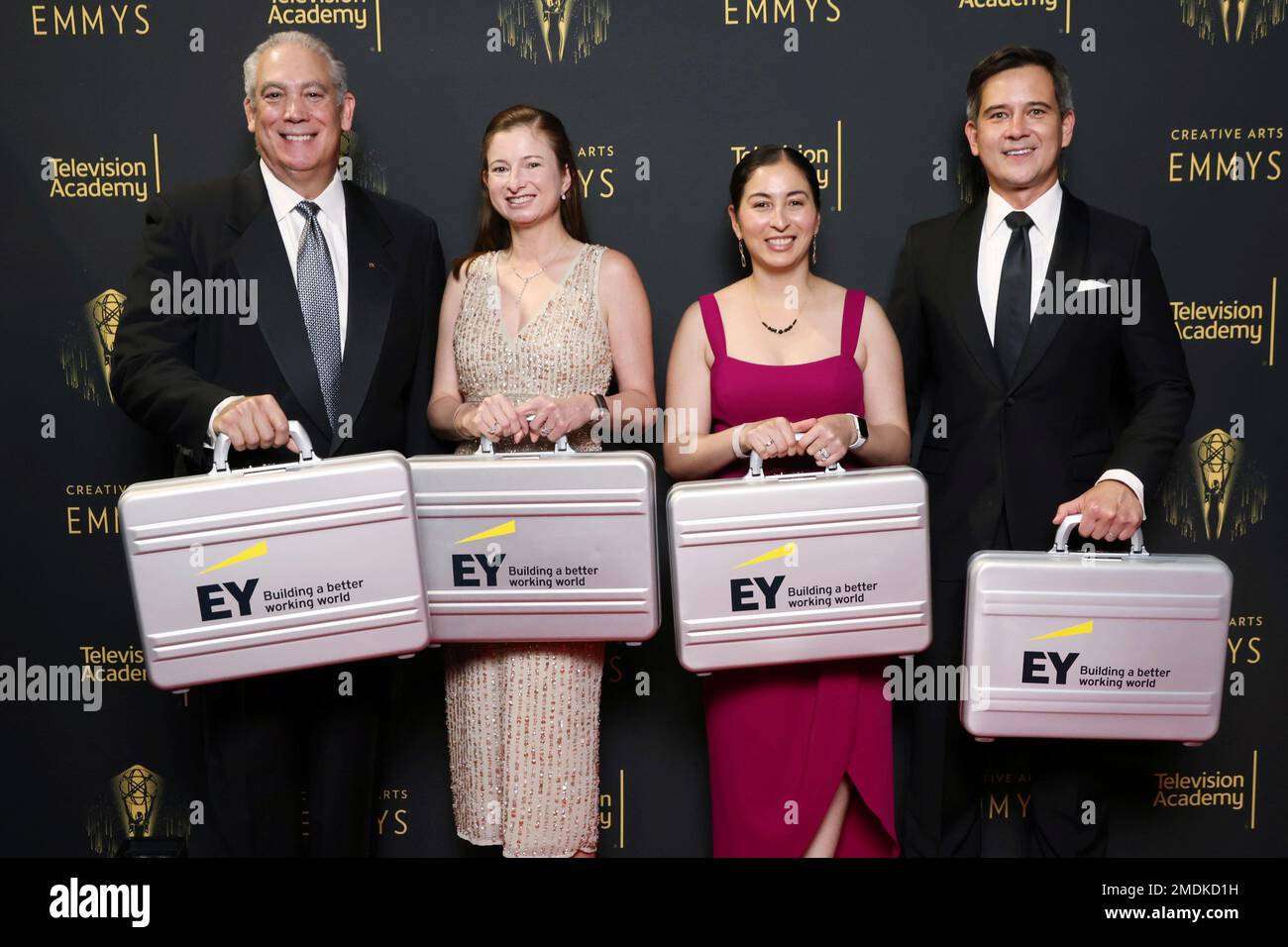 Representatives from EY pose for a portrait during night one of the ...