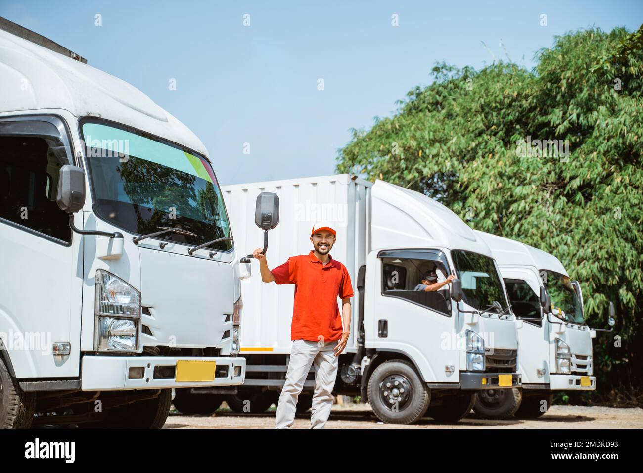 asian delivery man driver standing with cargo transport truck ...