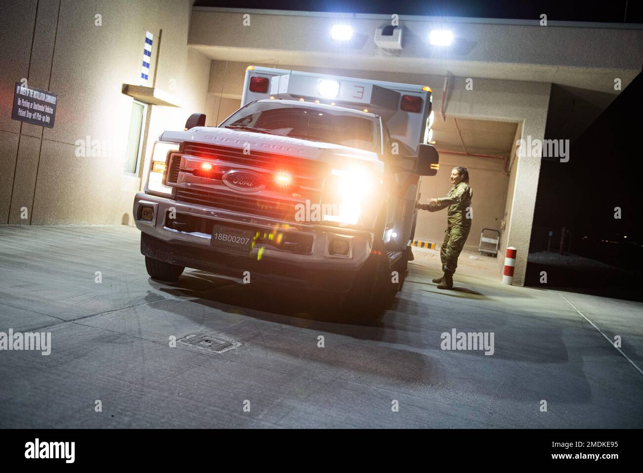 An ambulance flashes it lights during a vehicle checkout inspection ...