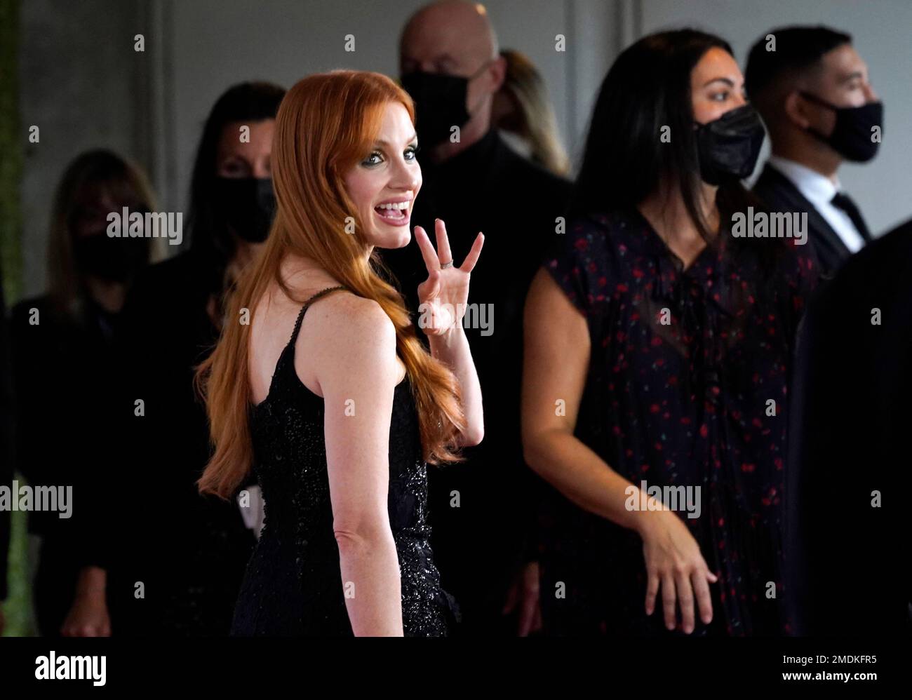 Jessica Chastain, a cast member in "The Forgiven," waves to ...