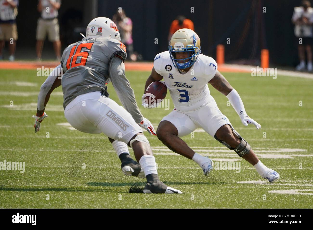 Tulsa running back Shamari Brooks (3) is defended by Oklahoma State ...