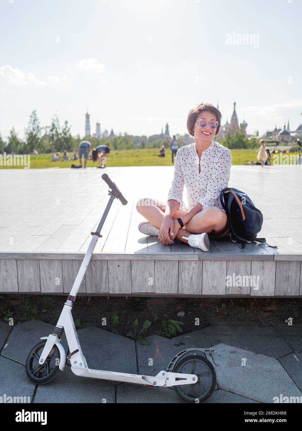 Kick scooter young woman park hi-res stock photography and images - Alamy