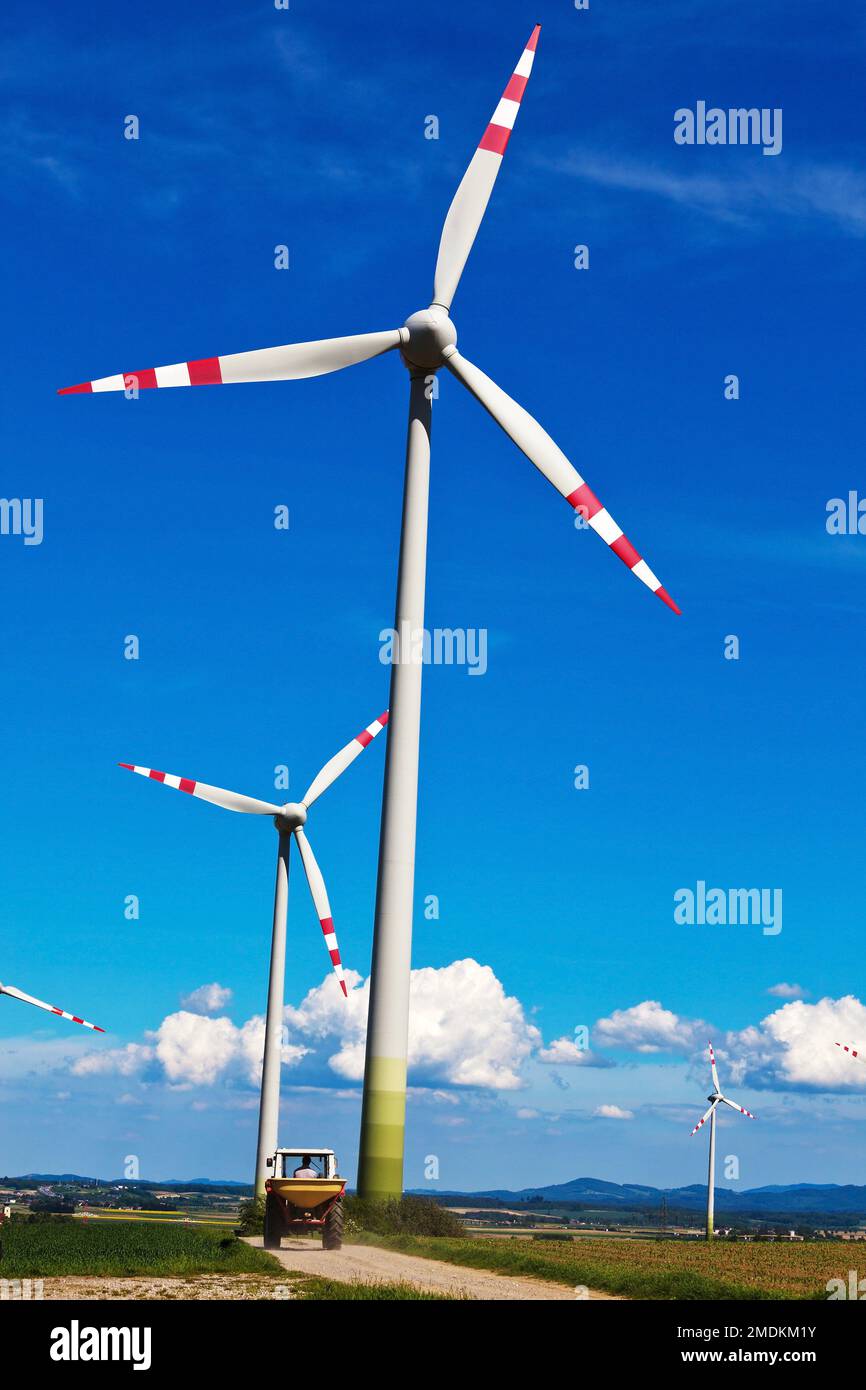 wind wheels in front of blue cloudy sky, Austria Stock Photo - Alamy