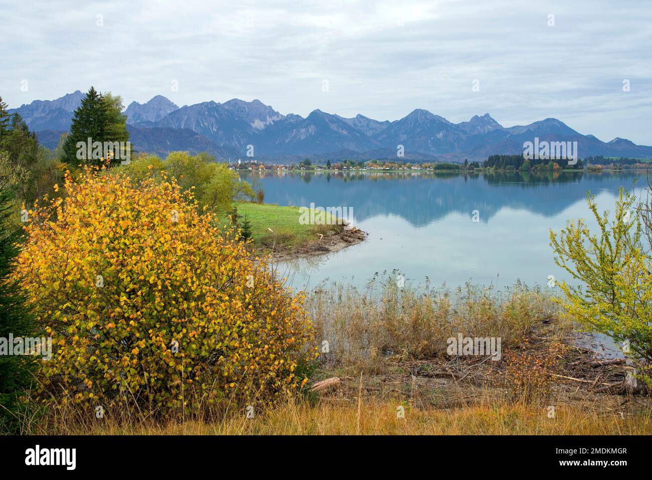 view over the Forggensee lake to the Allgaeu and Tannheim Mountains ...