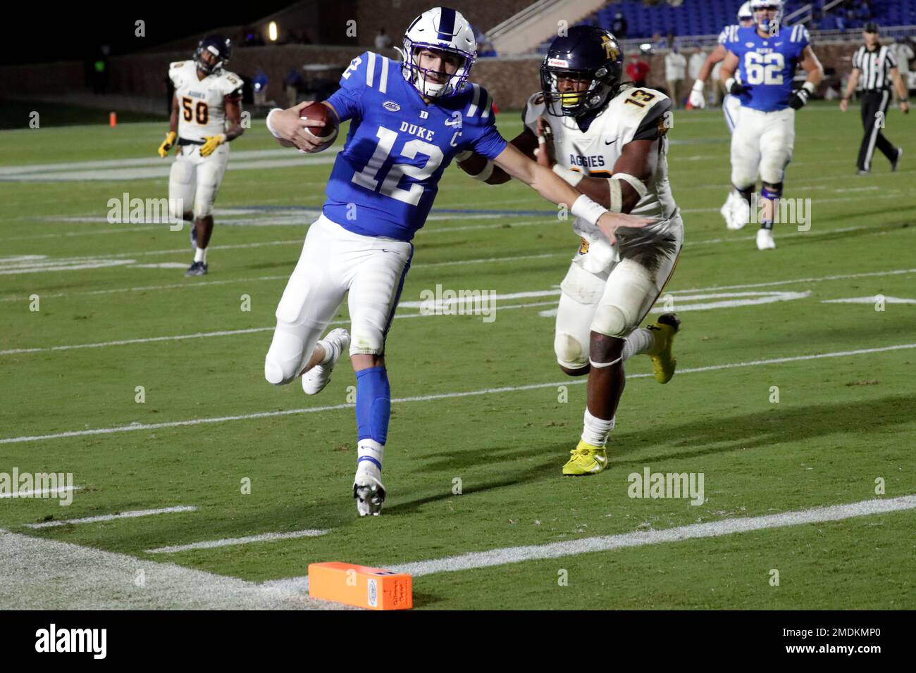 Duke quarterback Gunnar Holmberg (12) runs for a touchdown against ...