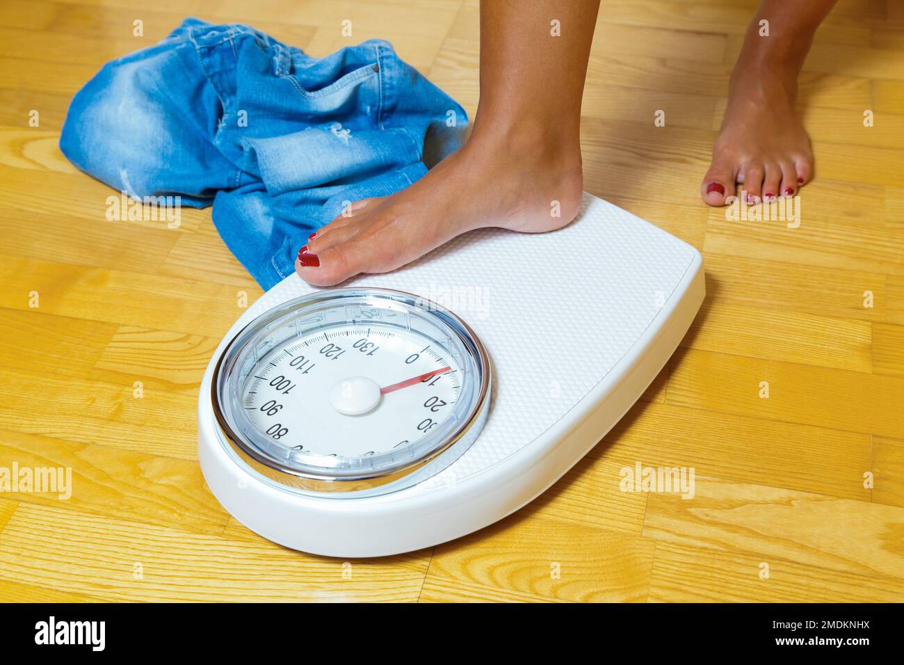 woman standing on a scale Stock Photo - Alamy
