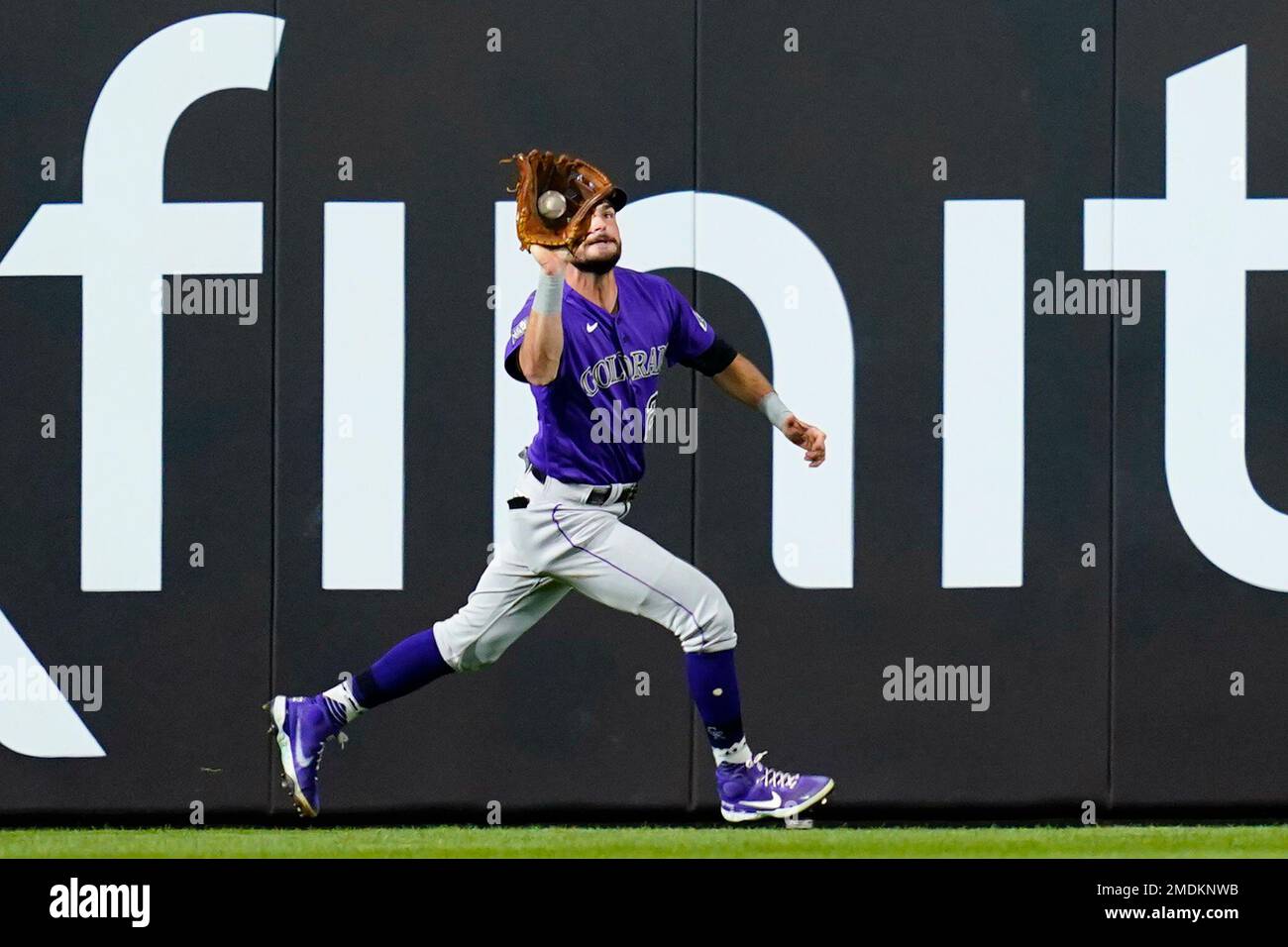 Colorado Rockies left fielder Sam Hilliard catches a fly out by ...