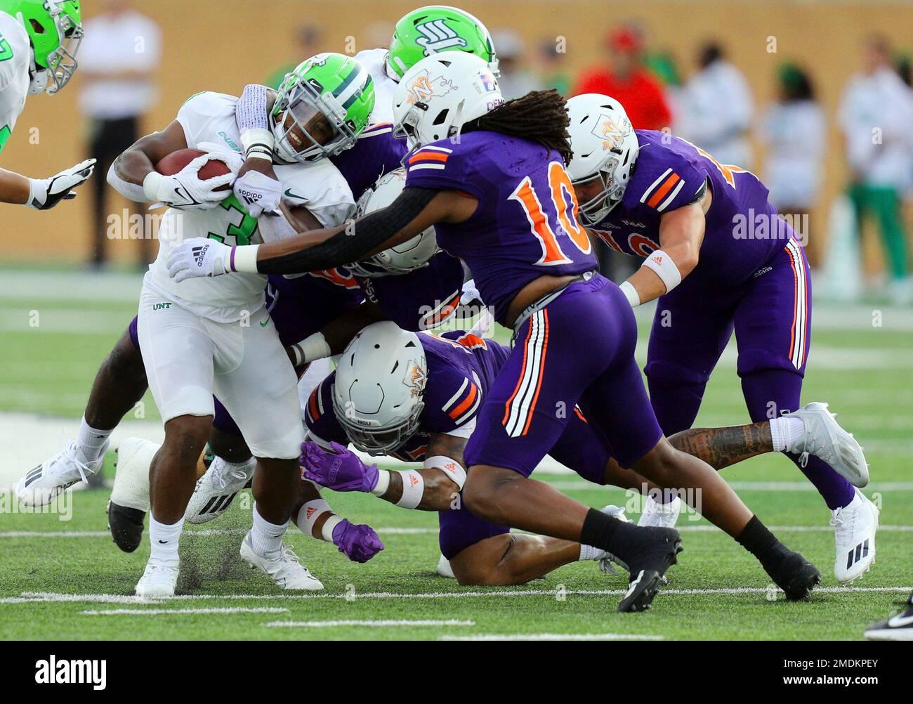 North Texas running back DeAndre Torrey (3) is hit by Northwestern ...