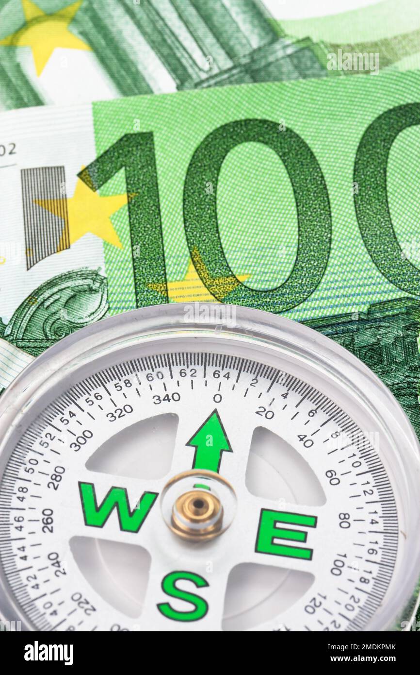 100 Euro bills with compass Stock Photo - Alamy