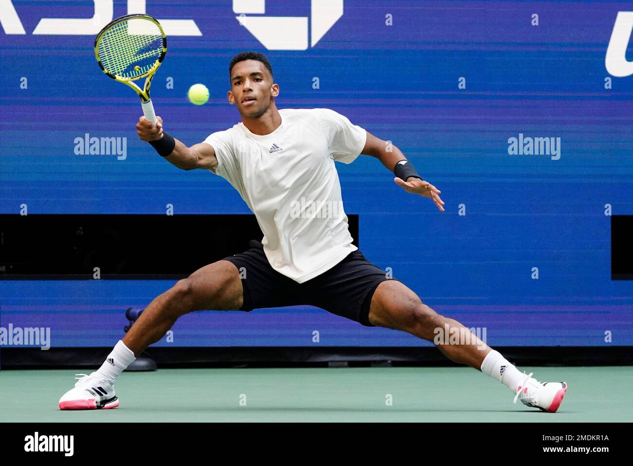 Felix Auger-Aliassime, of Canada, returns a shot to Daniil Medvedev, of Russia, during the ...