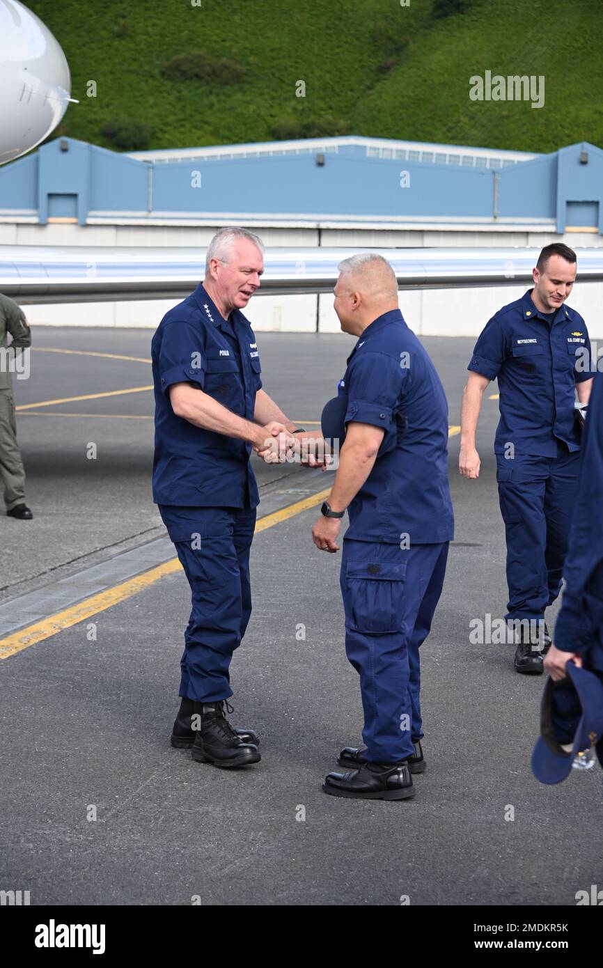Adm. Steven D. Poulin, U.S. Coast Guard Vice Commandant, shakes hands ...