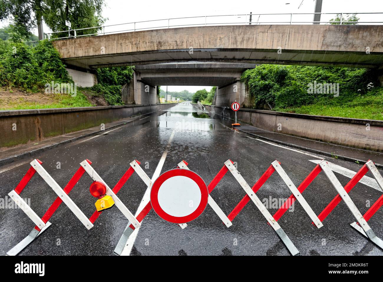 street is flooded and closed after heavy rains, Austria Stock Photo - Alamy