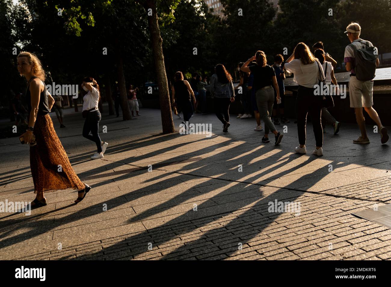 Visitors browse the north pool at the National September 11 Memorial ...