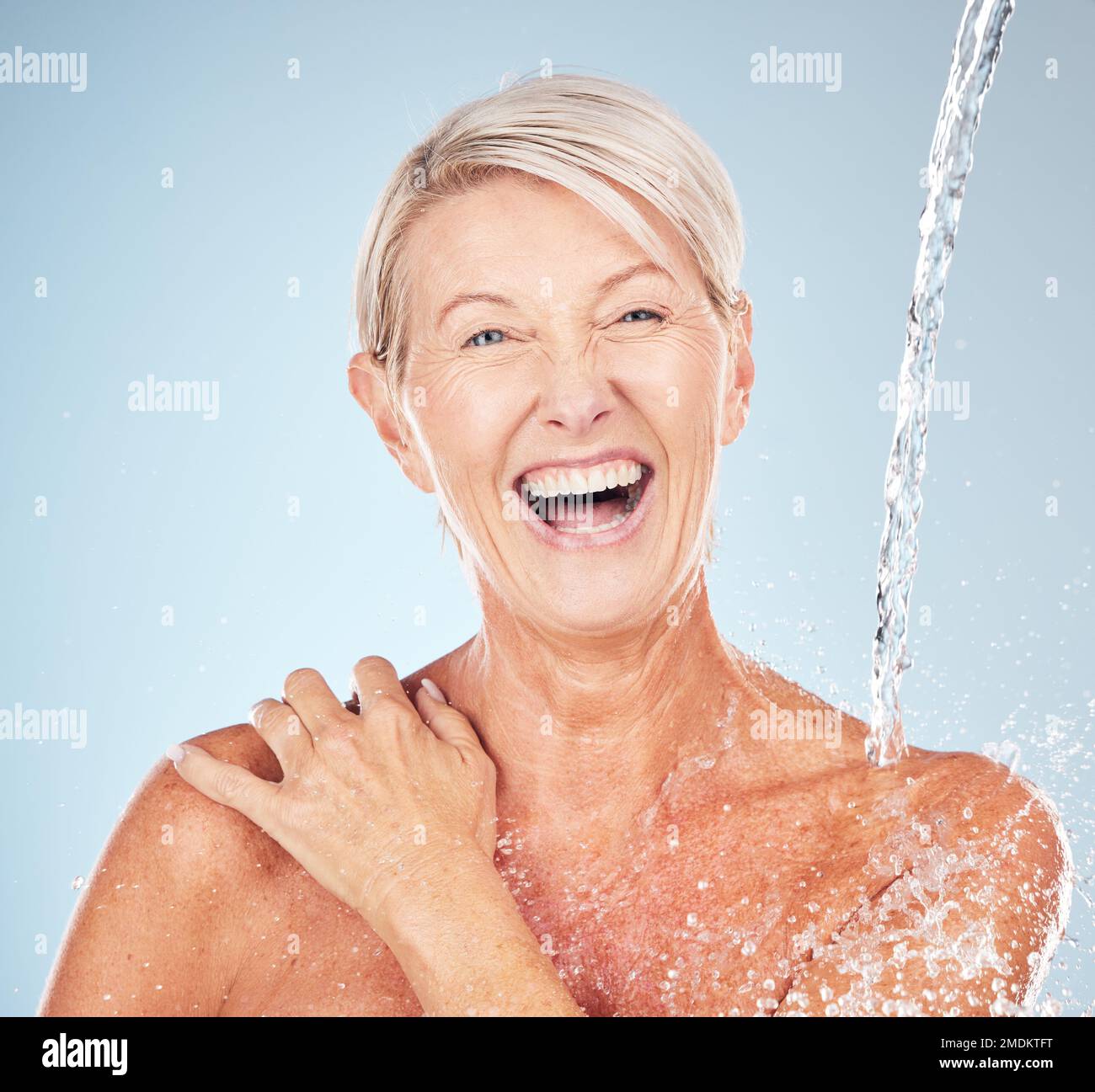 Happy, cleaning and portrait of a woman with a water splash isolated on ...