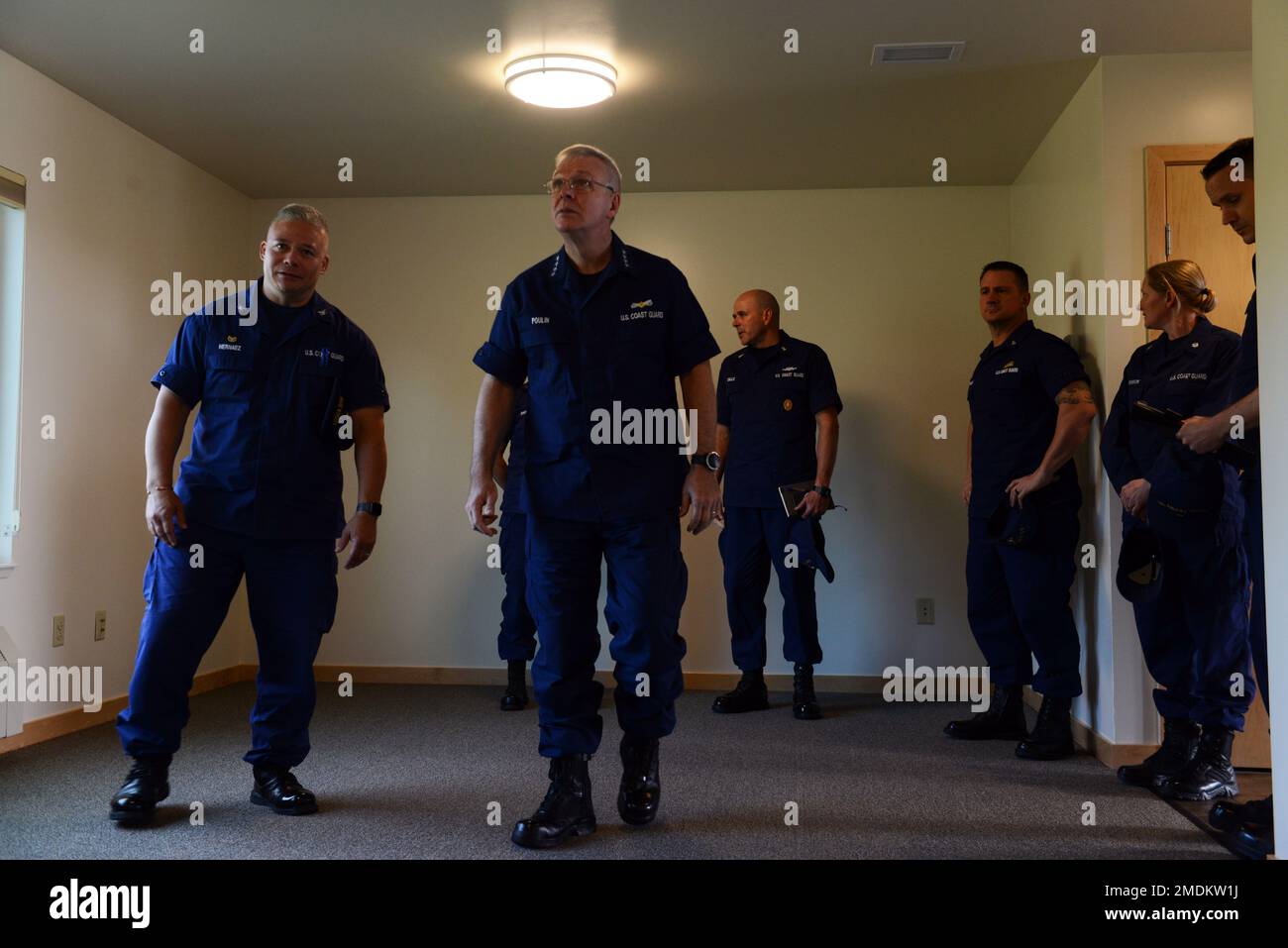 Adm. Steven D. Poulin, U.S. Coast Guard Vice Commandant (center), tours ...