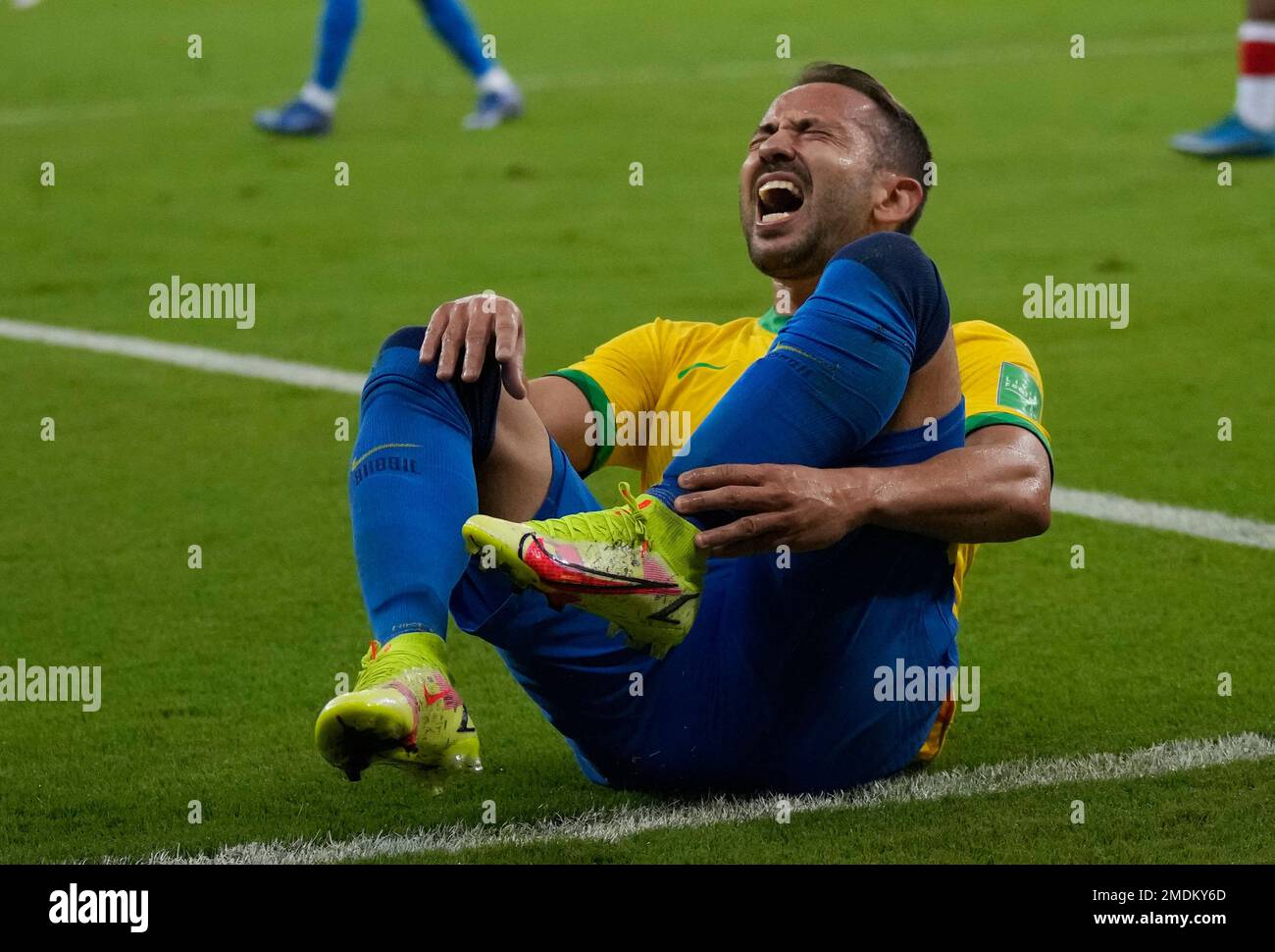 Brazil's Everton Ribeiro grimaces in pain during a qualifying soccer ...