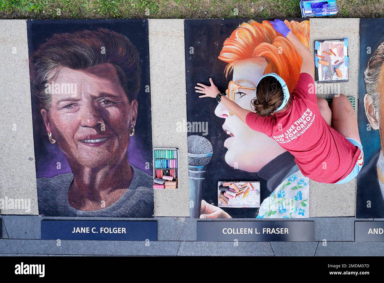 Chalk artist Erica LuBer, from Allentown, Pa., works on a chalk ...