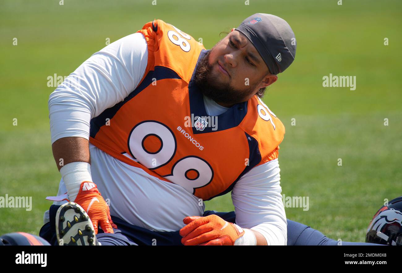 Denver Broncos nose tackle Mike Purcell stretches during an NFL ...