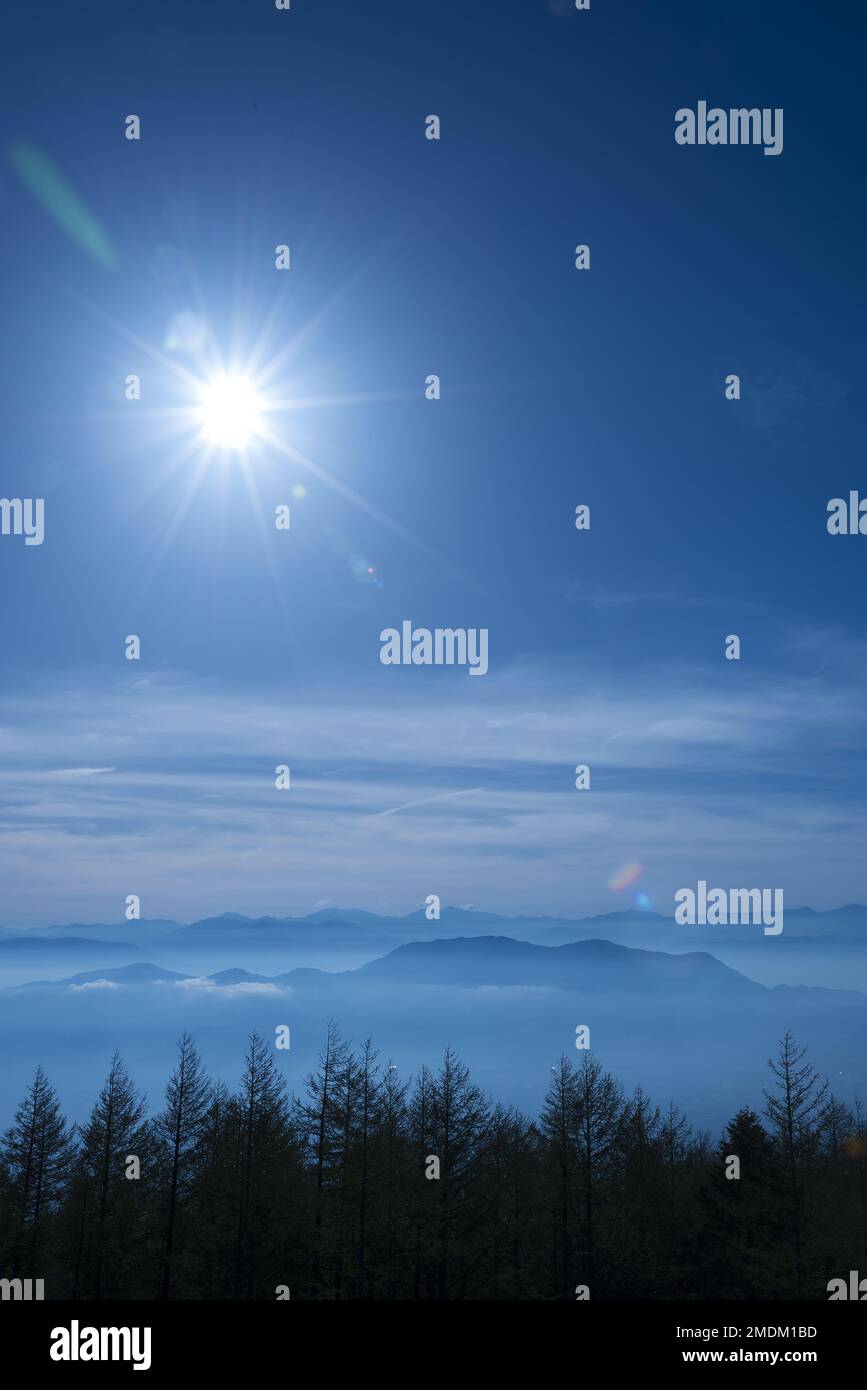 Japan mountain range in hazy blue sunshine Stock Photo - Alamy