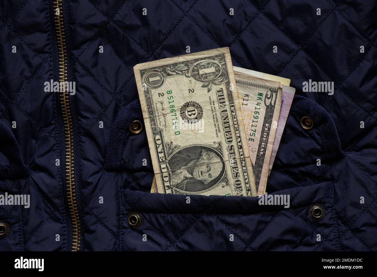 american dollar in winter jacket pocket, money in pocket, financial ...
