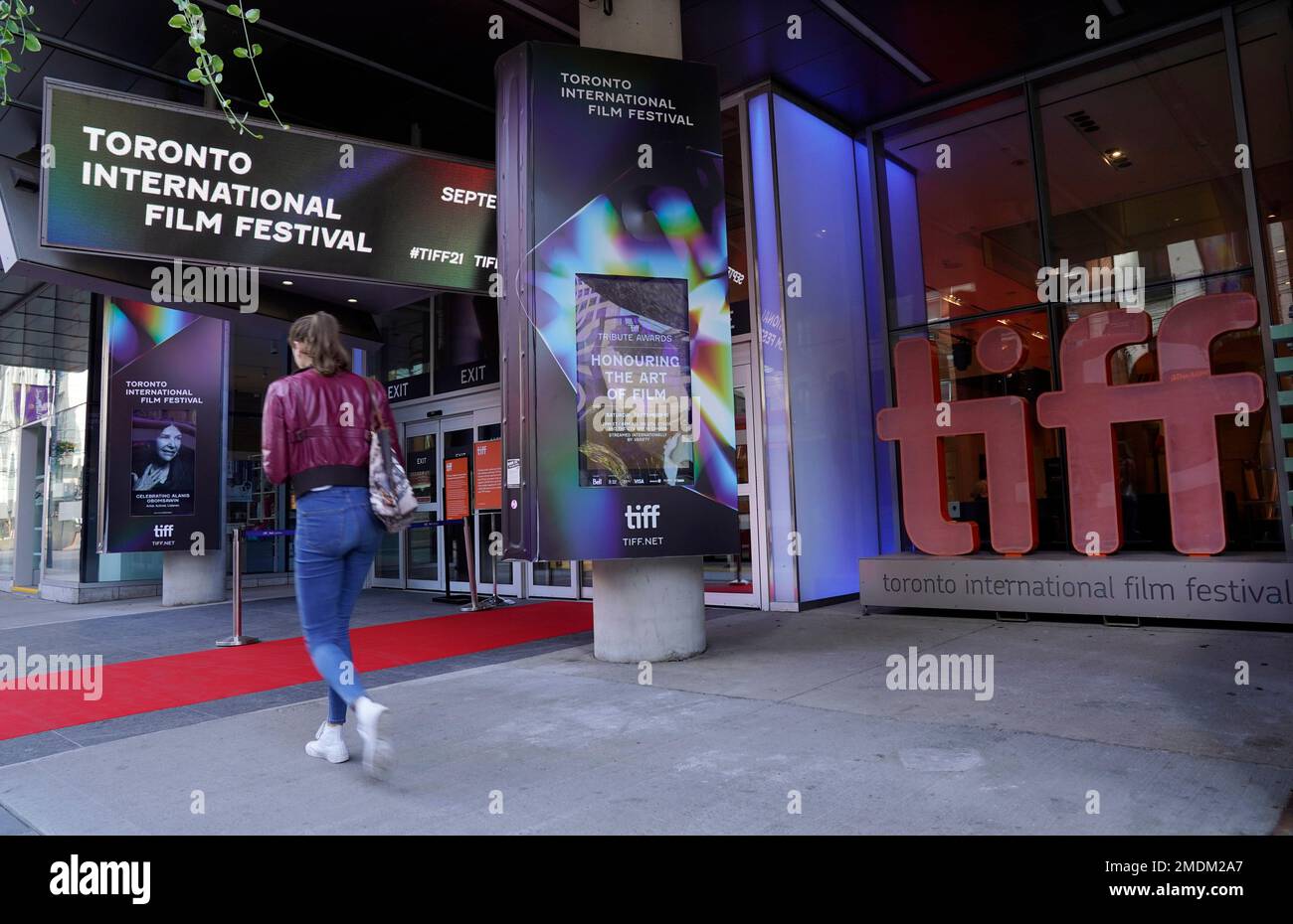 A pedestrian walks past the TIFF Bell Lightbox headquarters of the 2021 ...