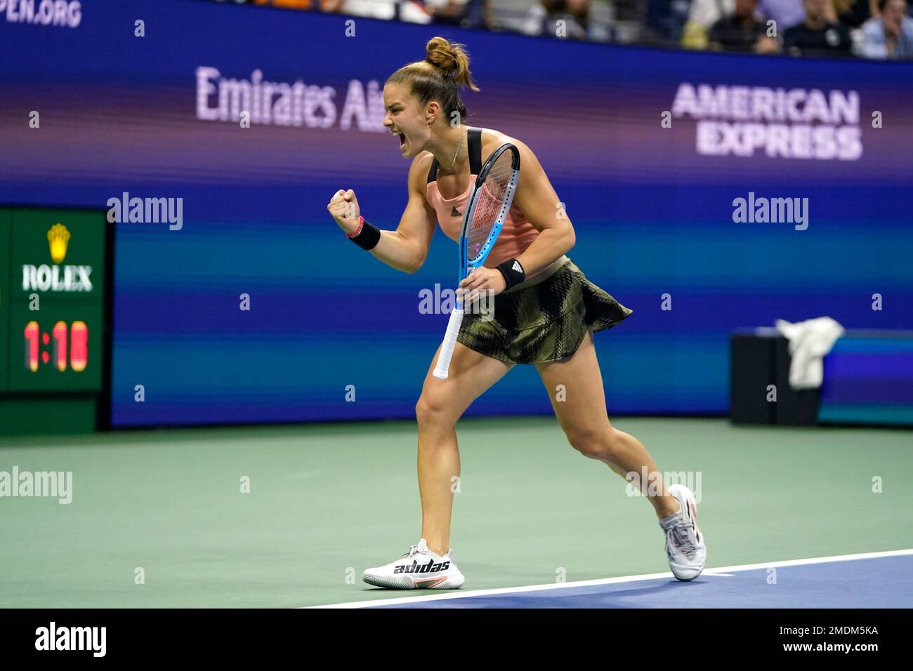 Maria Sakkari, of Greece, reacts to winning a point against Karolina ...