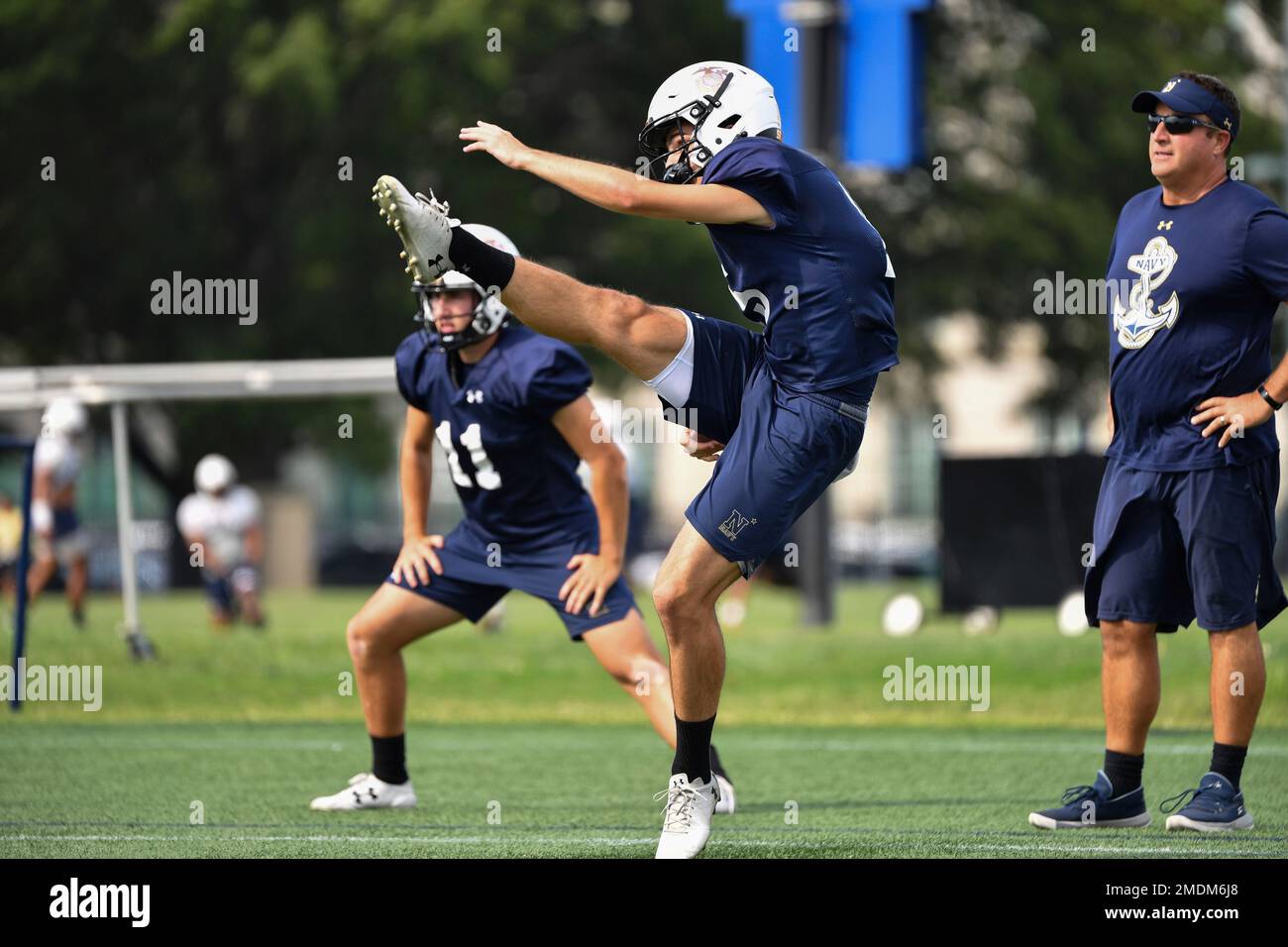Navy punter Kellen Grave de Peralta center, punts during NCAA college ...
