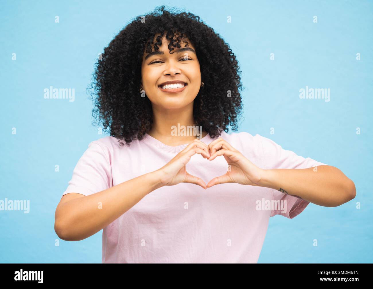 Heart hand sign, black woman and smile portrait of a young person ...