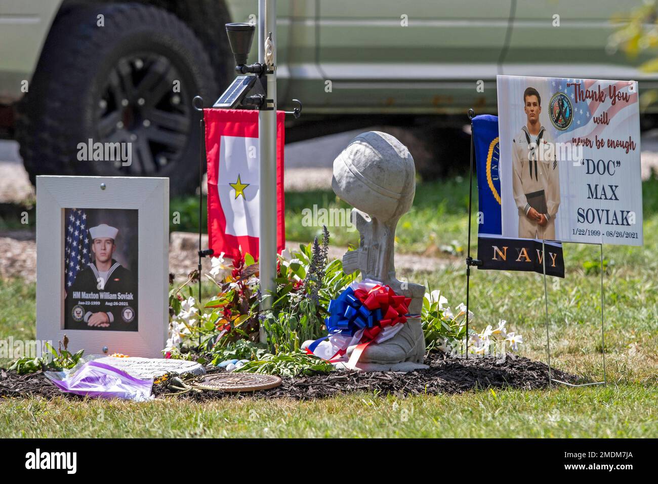 Signs in memory of Navy Corpsman Maxton Soviak outside the family home ...