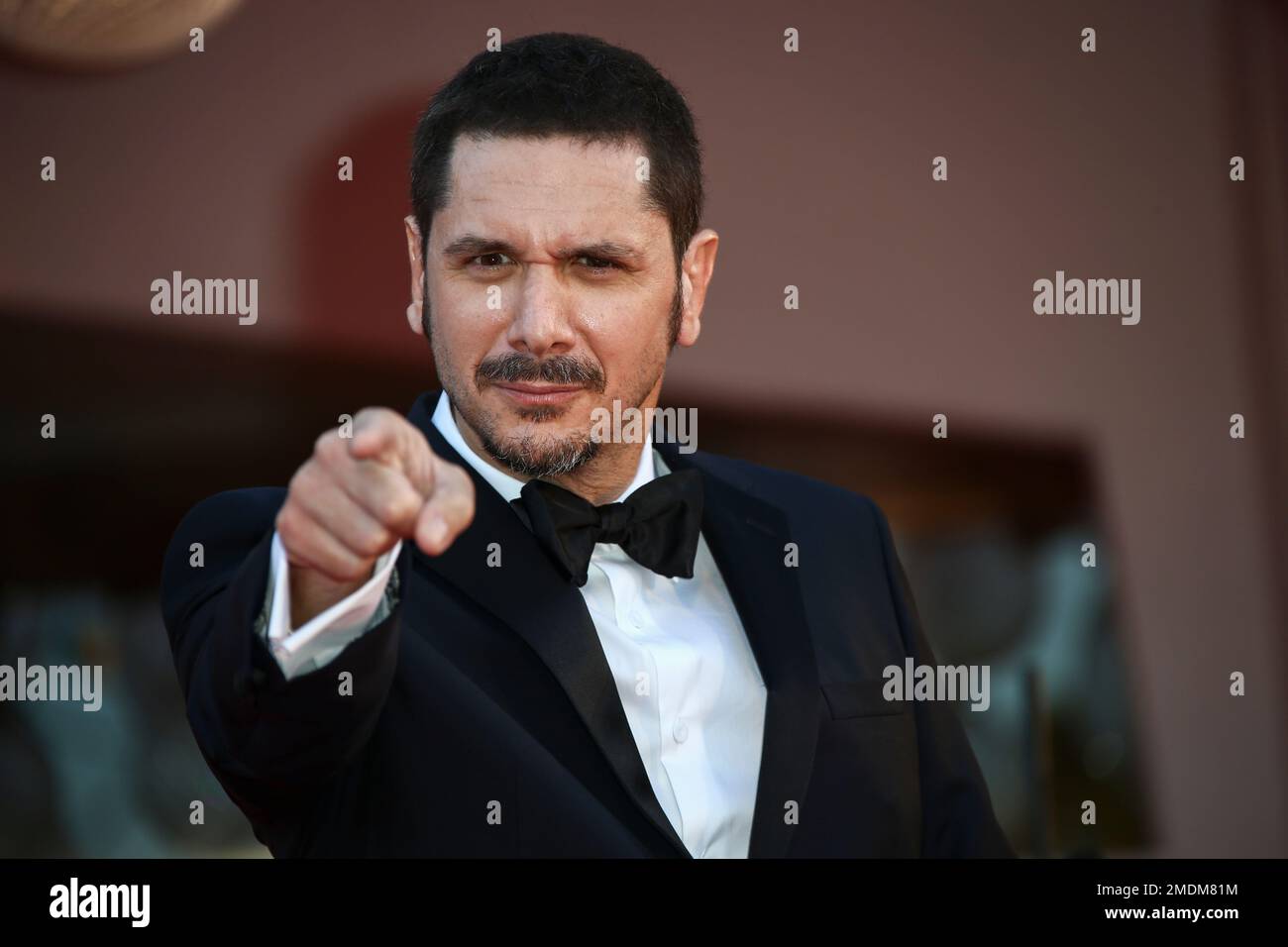 Gabriele Mainetti poses for photographers upon arrival at the premiere ...