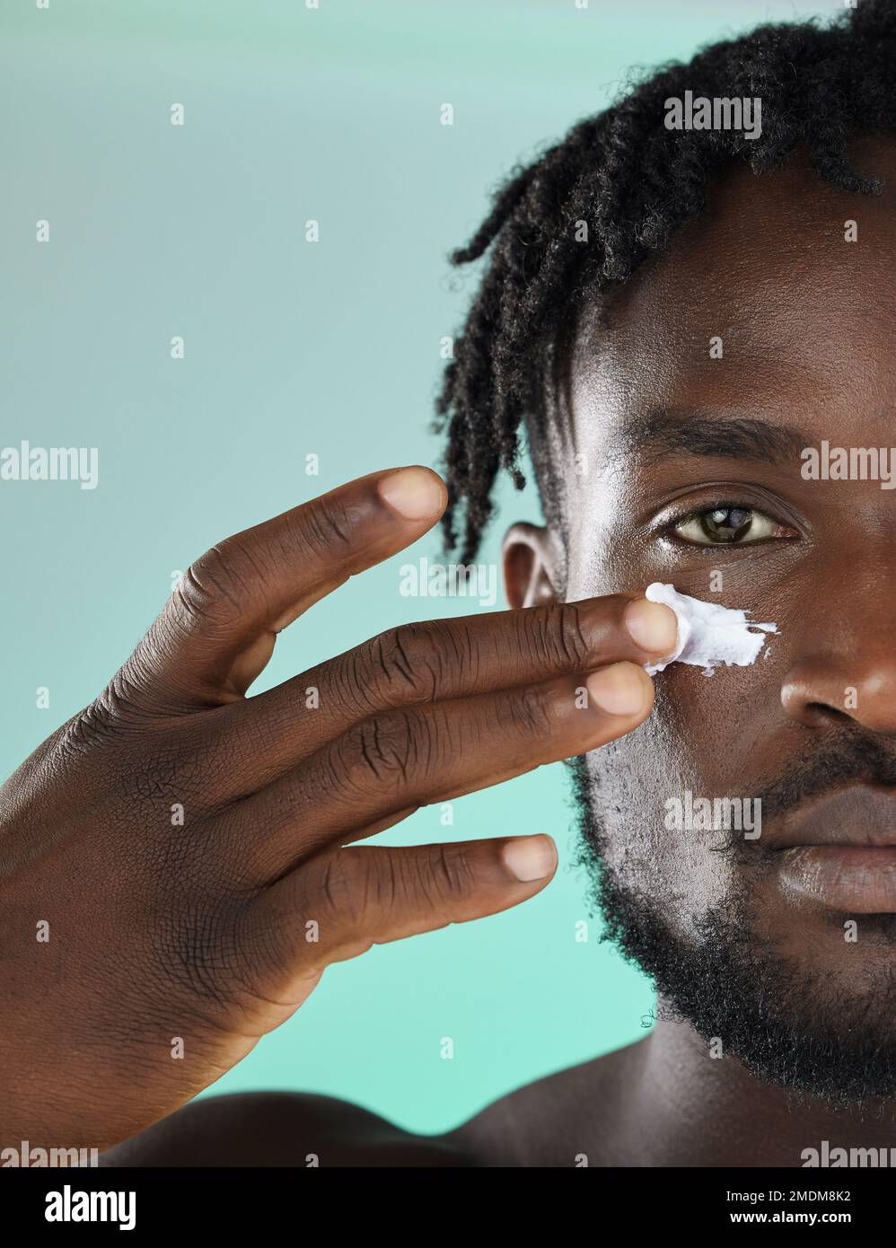 Black man, hands and face for skincare moisturizer, lotion or cream for ...