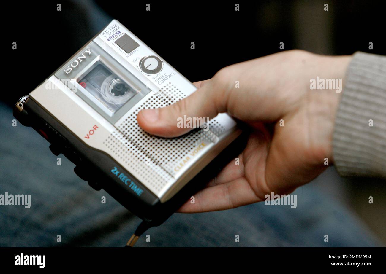 A journalist interviewing a person using a tape recorder Stock Photo ...