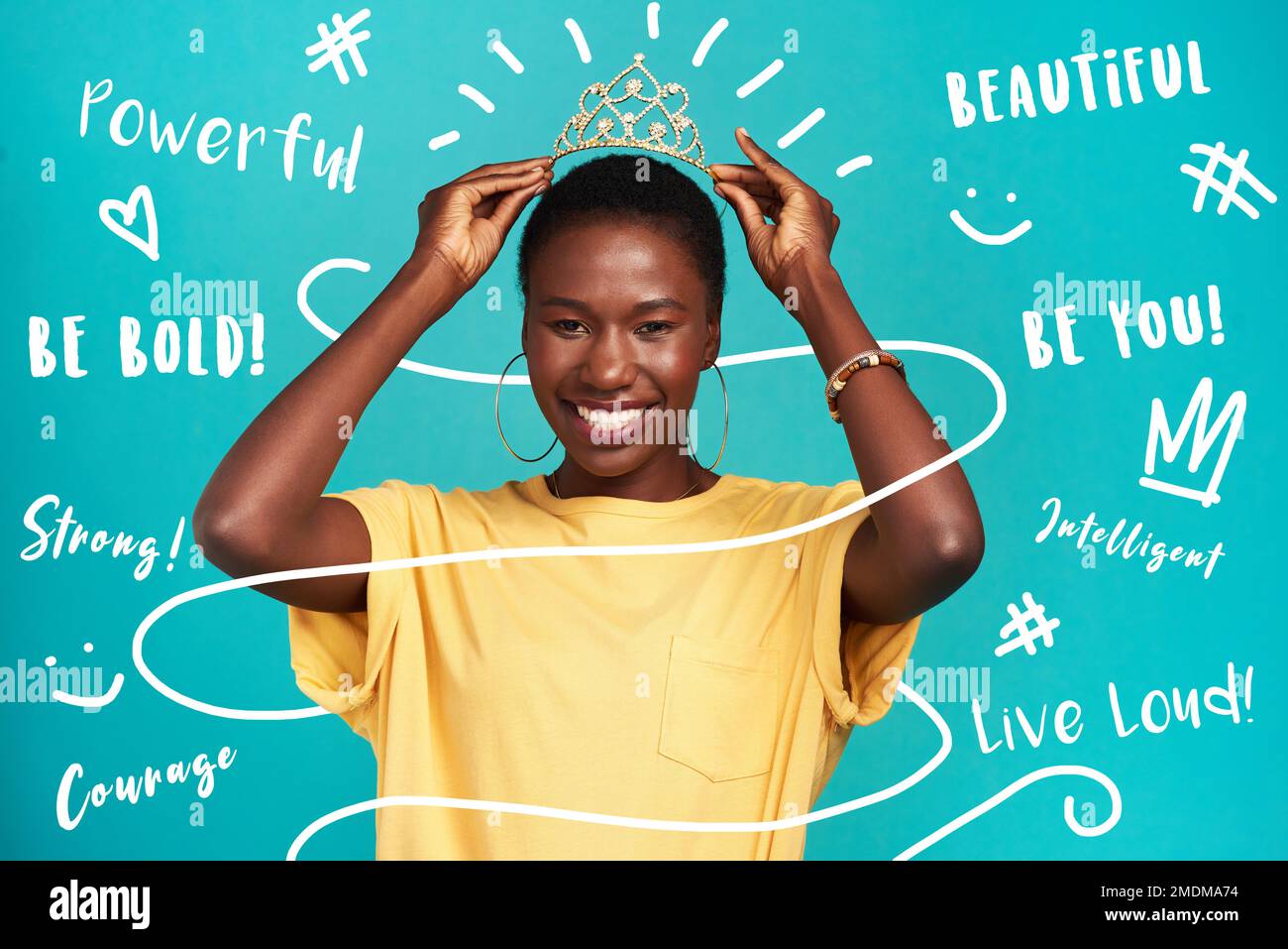 Wear your courage like a crown. Studio shot of a young woman putting a ...