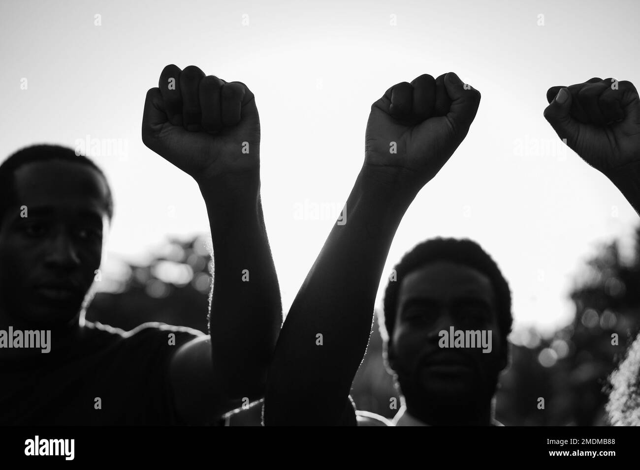 Black demonstrator people holding hands against racism - Focus on fists ...