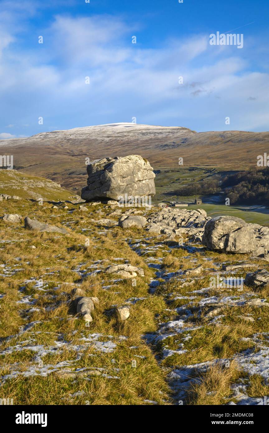 A large erratic boulder on Keld Head Scar with Whernside in the ...