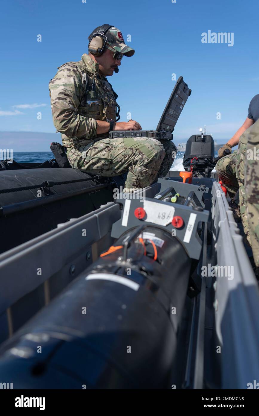 A Sailor assigned to Explosive Ordnance Disposal Mobile Unit (EODMU) 11 ...