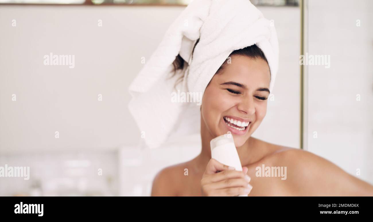 The day is yours to own. an attractive young woman singing while going ...