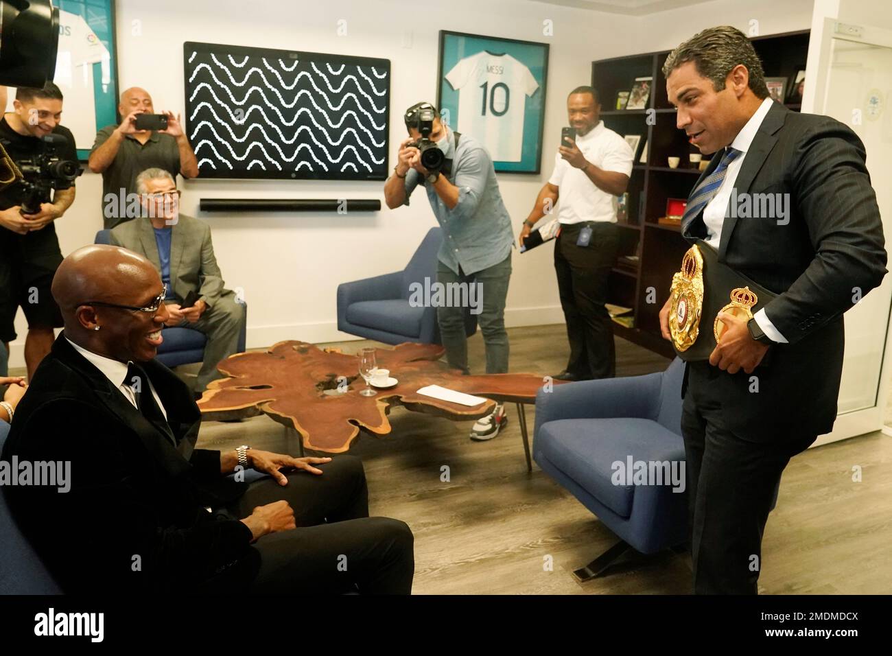 Miami Mayor Francis Suarez, right, holds up the WBA Welterweight ...