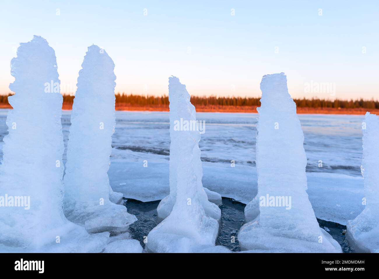 The remains of pillars of ice cut for drinking water are melted ...